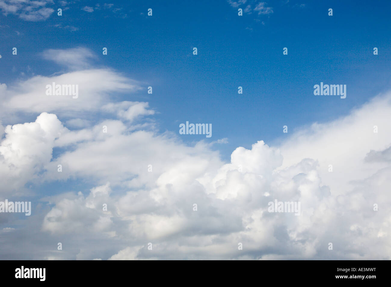 White cloud formations in a blue sky Stock Photo - Alamy