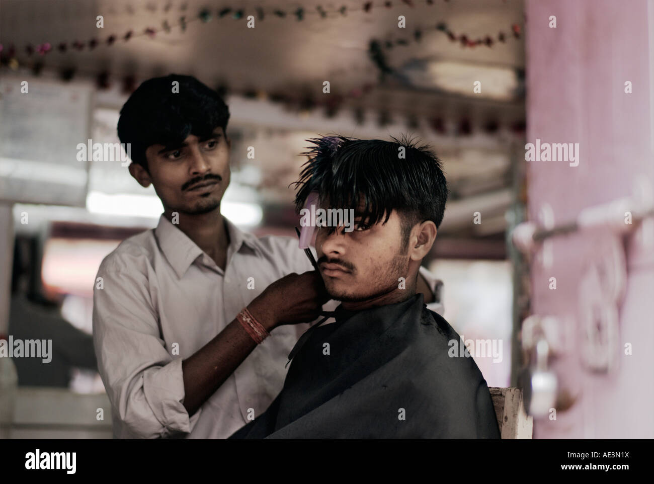 Man having his haircut in Nepalese barber Stock Photo - Alamy