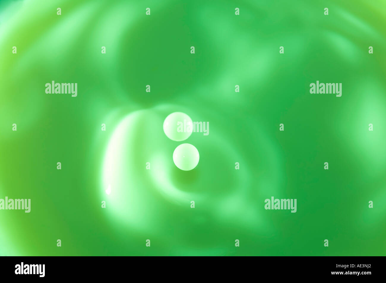 colored fluid drops and ripples Stock Photo - Alamy