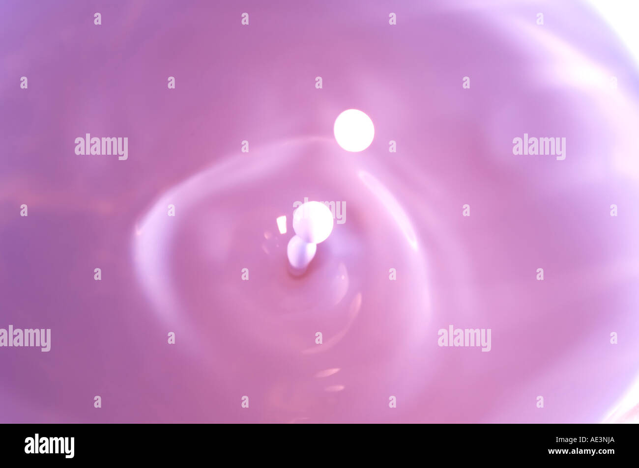 colored fluid drops and ripples Stock Photo - Alamy