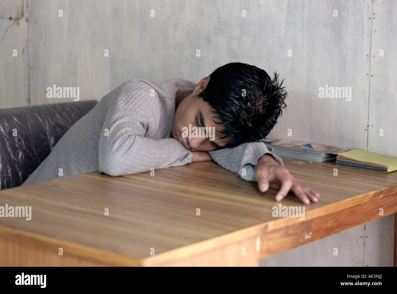 Man asleep at a desk Stock Photo - Alamy