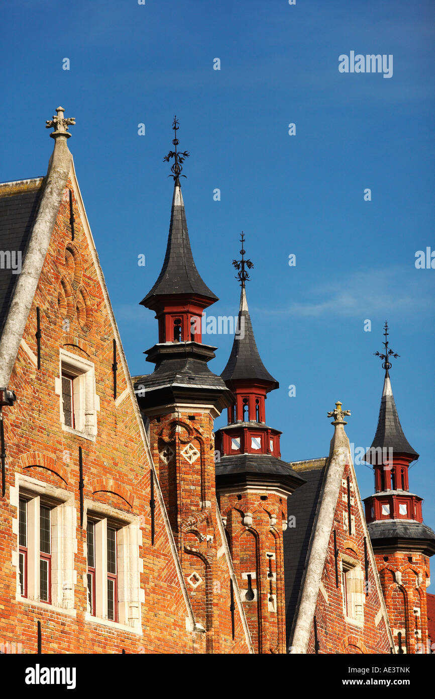Medieval roof tops along Steenhouwersdijk with blue sky Bruges Belgium ...