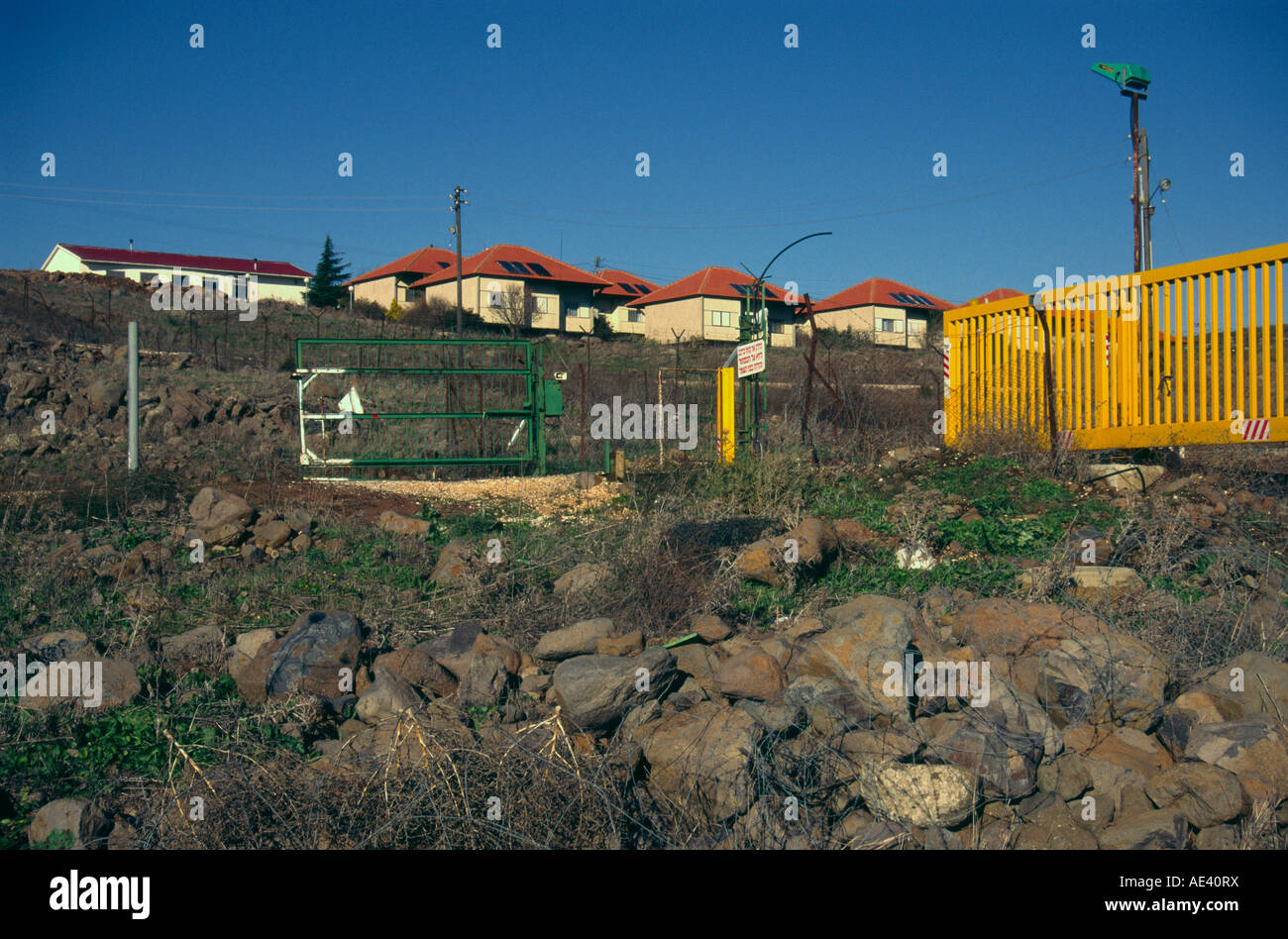 View of newly built houses, with electric gate and basalt rocks in ...
