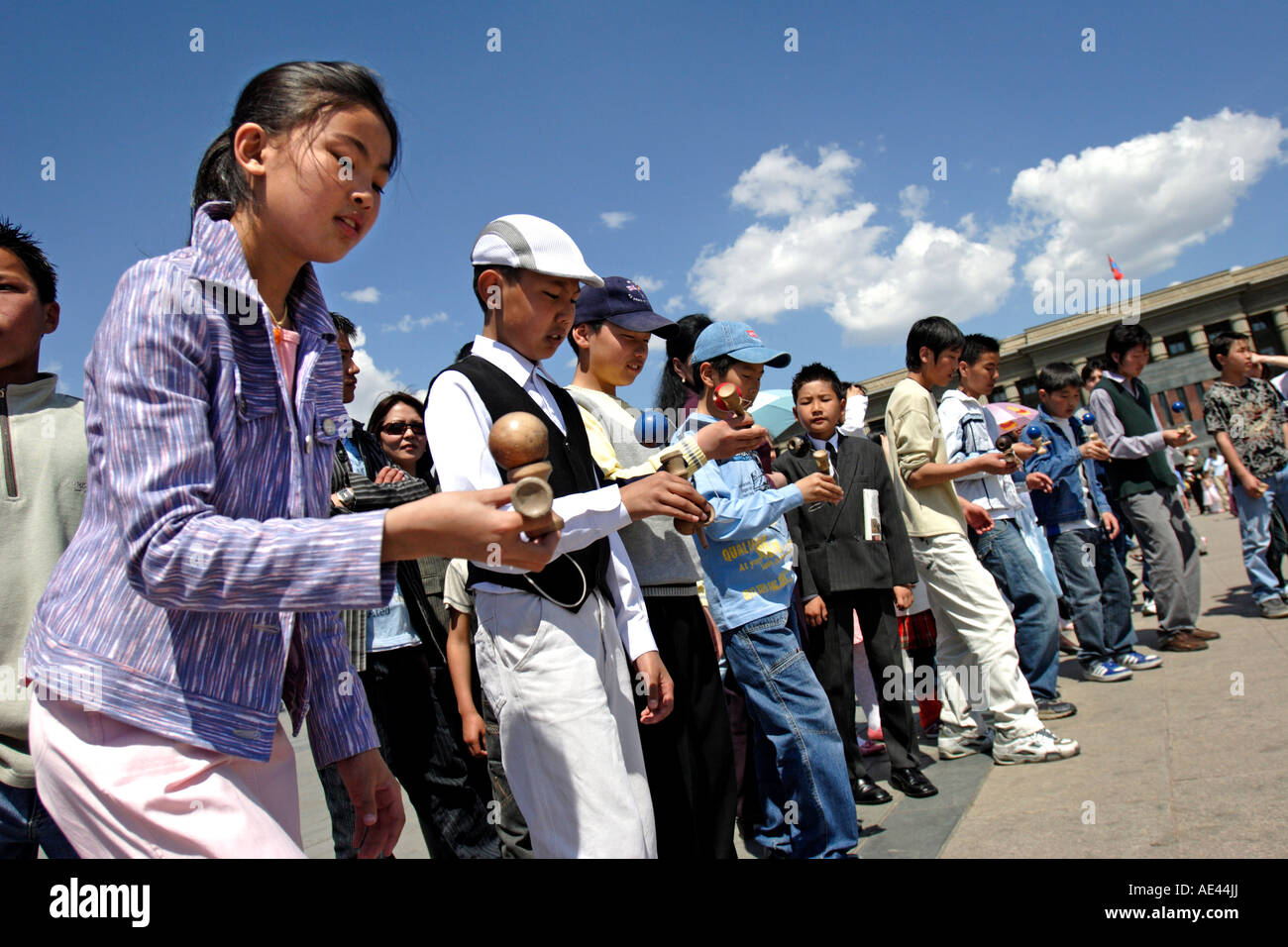 Playing a traditional game at the Children's Day festival, Ulaan Baatar ...