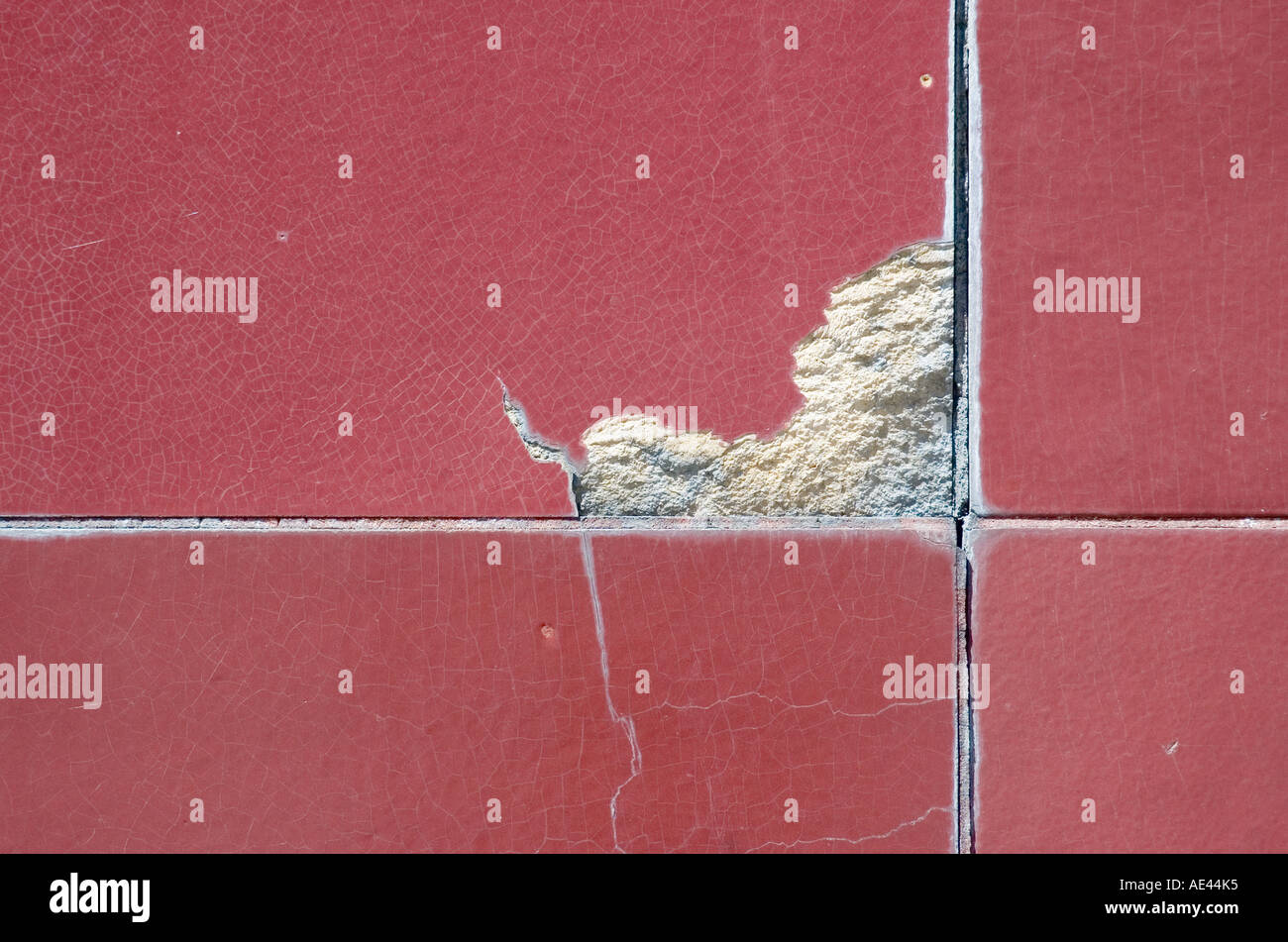 Broken wall tile Stock Photo - Alamy