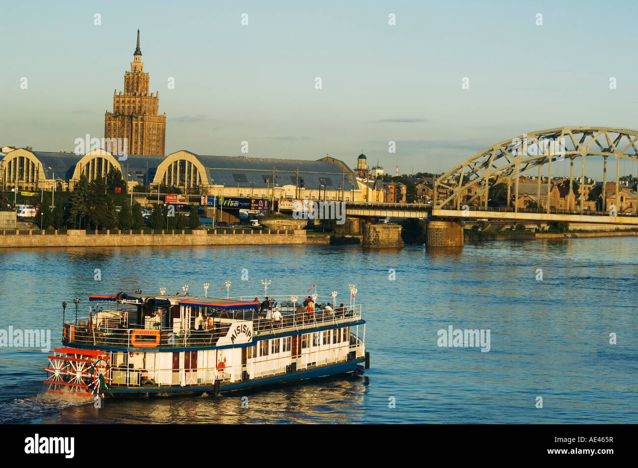 Mississippi tourist paddle boat on Daugava River, railway bridge, Riga ...