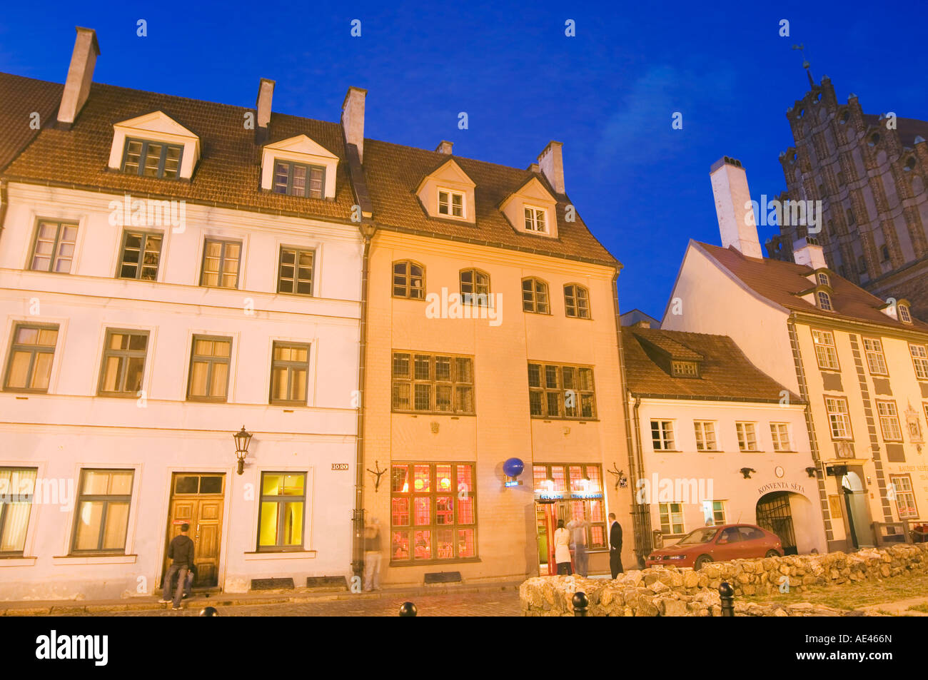 Pastel coloured buildings lit up at night, Old Town, UNESCO World ...