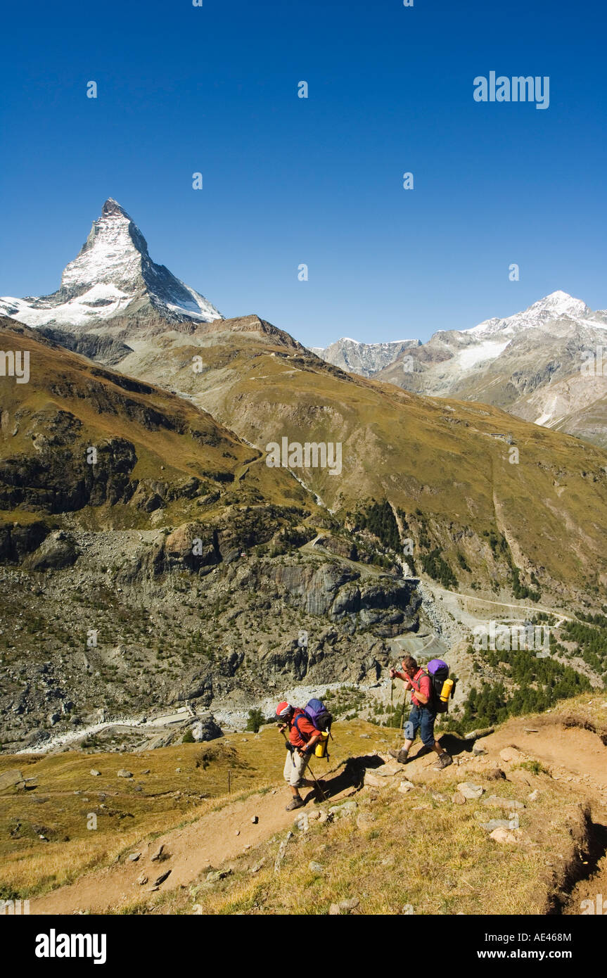 Hikers walking on trail near the Matterhorn, 4477m, Zermatt Alpine ...