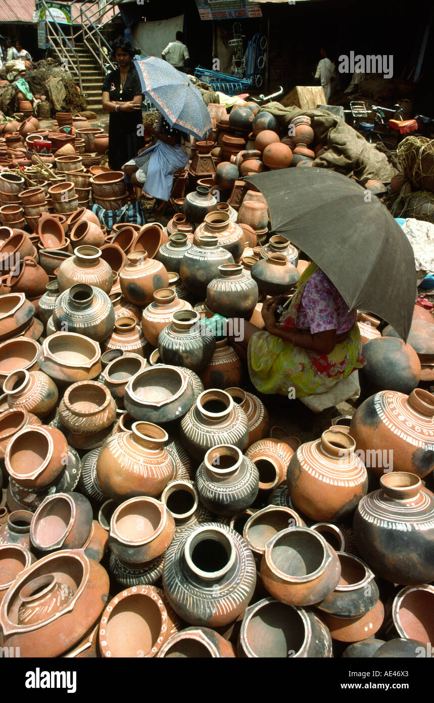 India Goa Mapusa market crafts pottery market women sheltering from sun ...