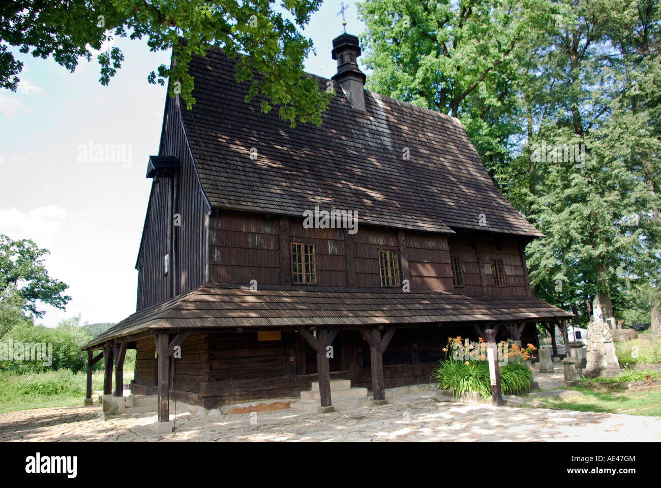 Overview of St. Leonard's wooden church showing arcade and shingle roof ...