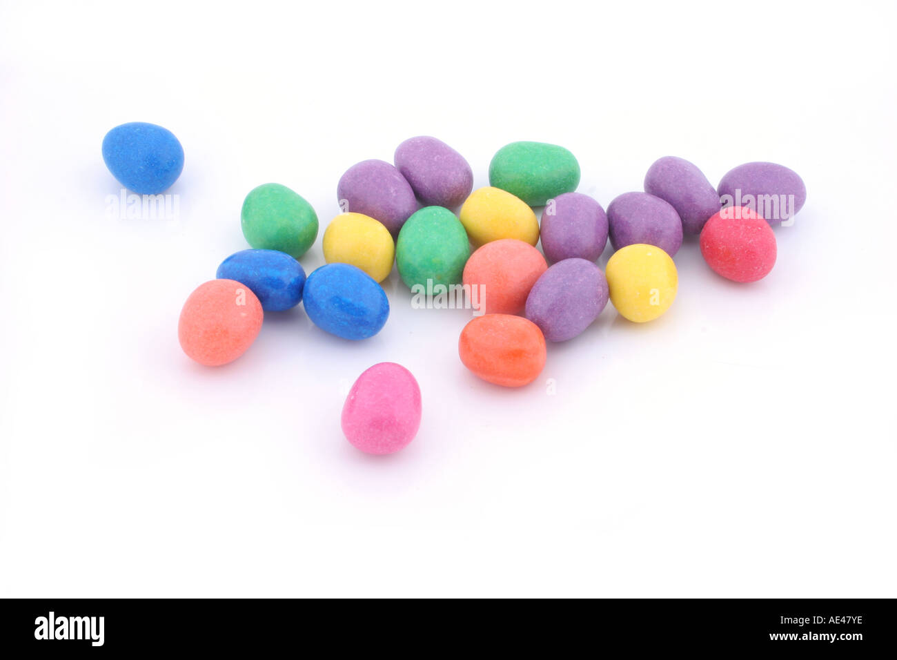 Colored egg shaped sweets on a white studio background Stock Photo - Alamy