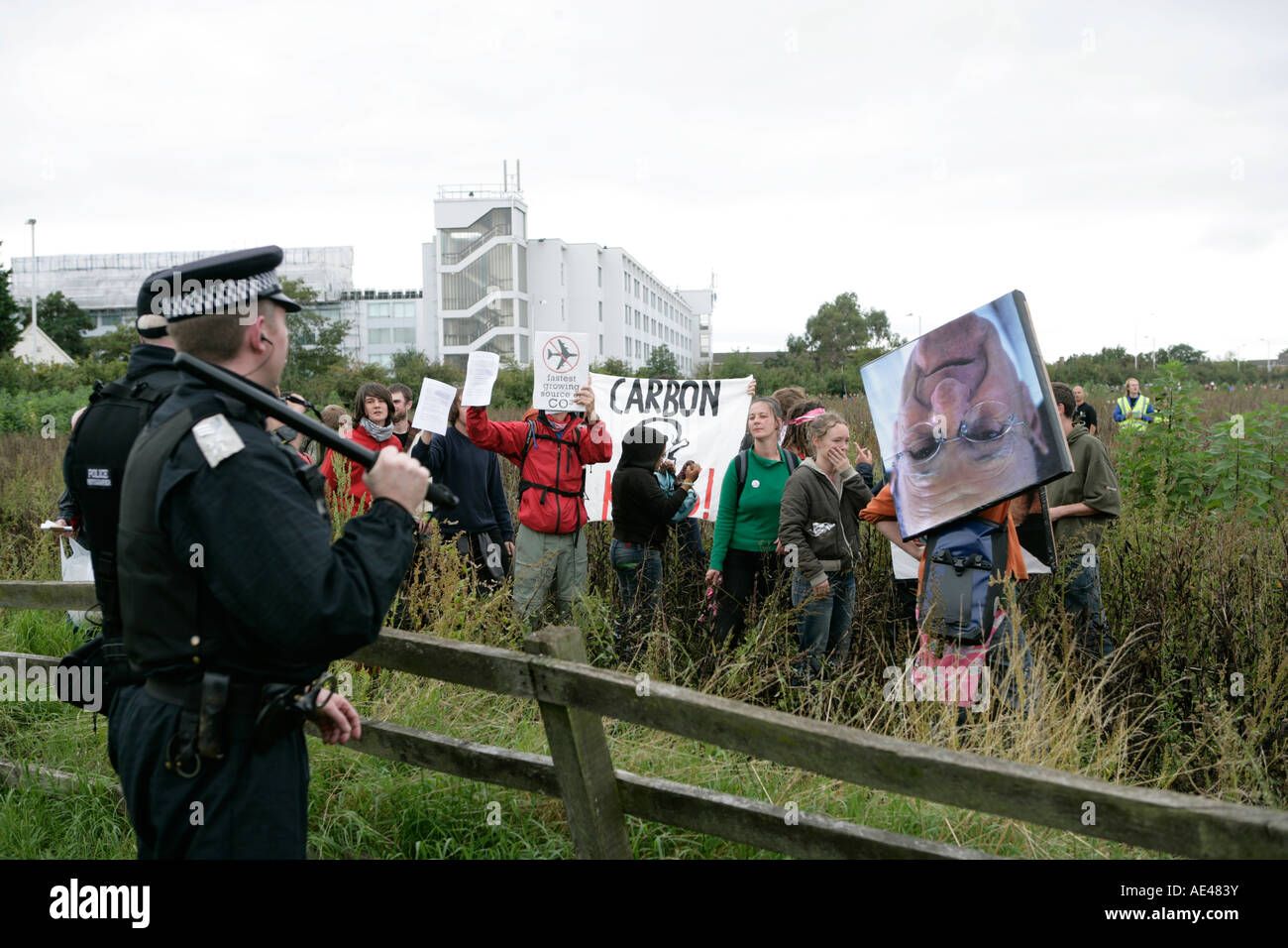 Climate change protesters face up to riot police Stock Photo - Alamy