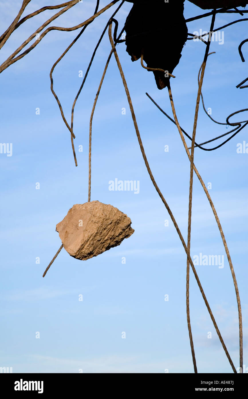 A lump of concrete hanging from a reinforcing cable Stock Photo - Alamy