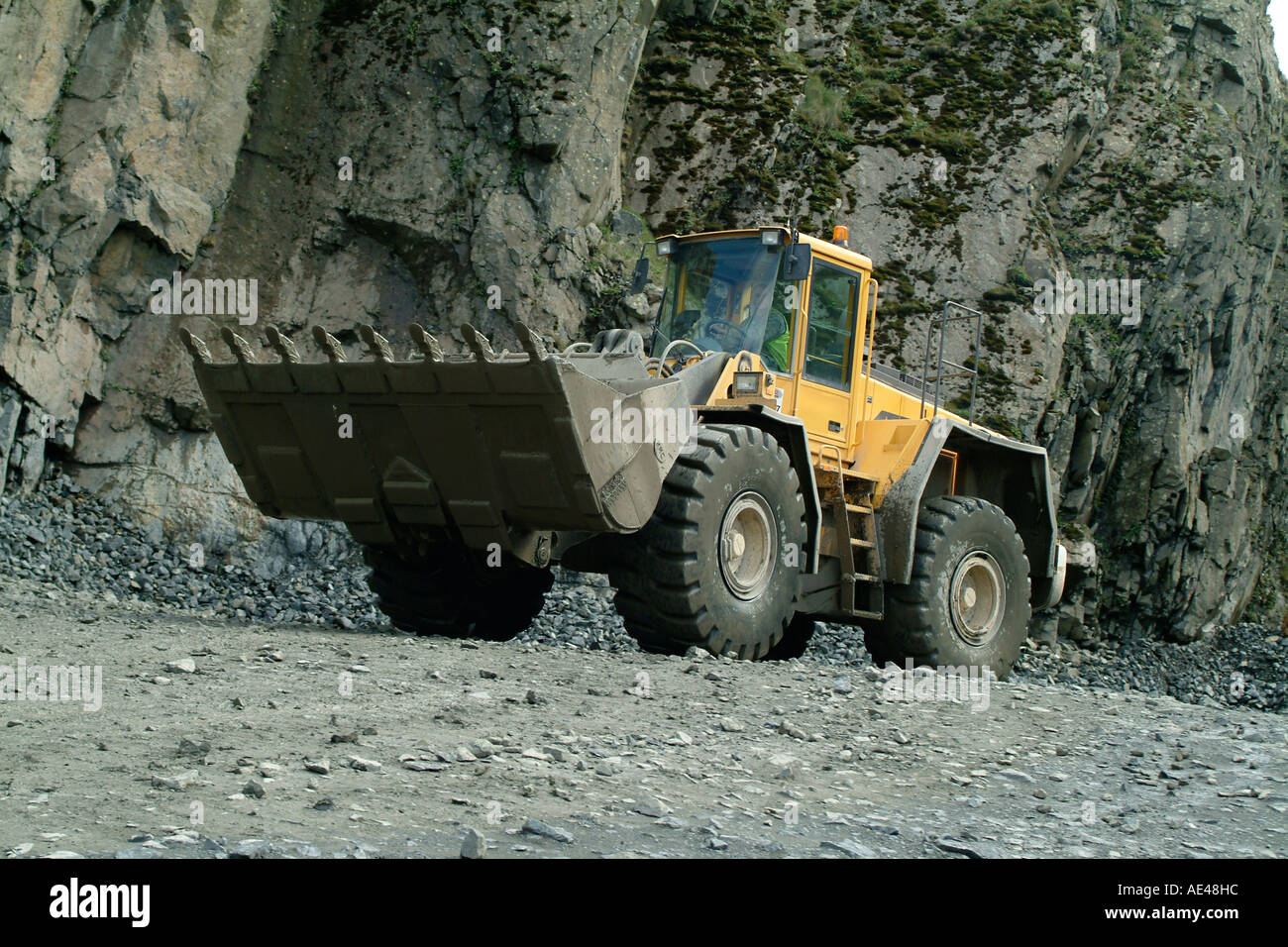 Yellow Volvo L150D wheeled loader working in a quarry in England Stock ...