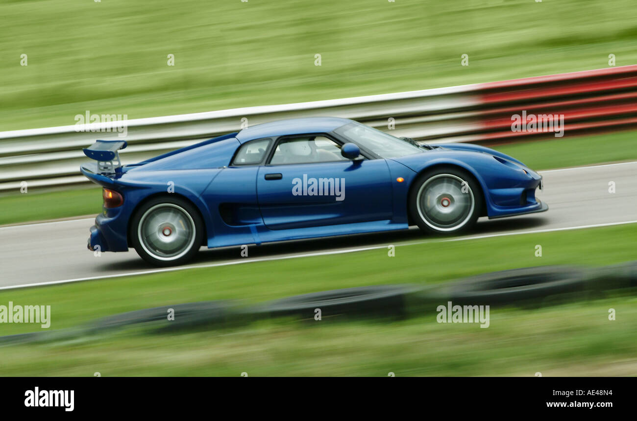 Blue Noble m12 sports car at speed on a race track in the uk Stock ...