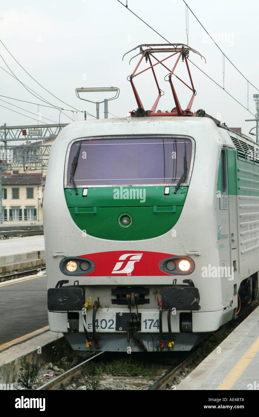 Class 402 electric train locomotive pulling into a railway station in Italy Stock Photo - Alamy