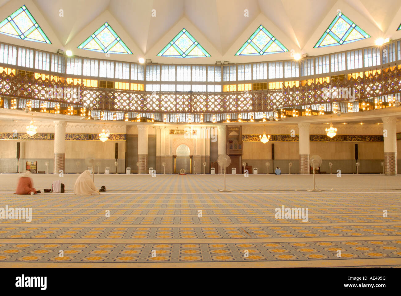 Two women inside prayer hall of National (Negara) Mosque, Kuala Lumpur ...