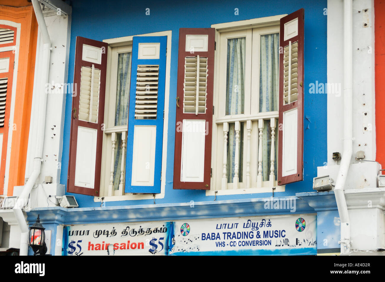 Colourfully painted window shutters in Little India, Singapore ...
