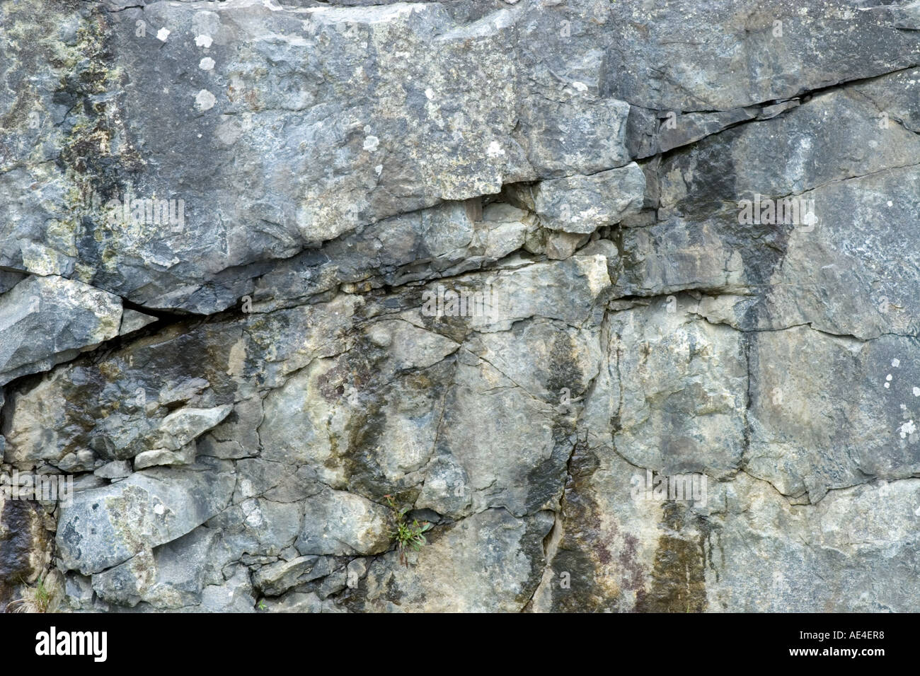 Rock wall, with cracks Stock Photo - Alamy