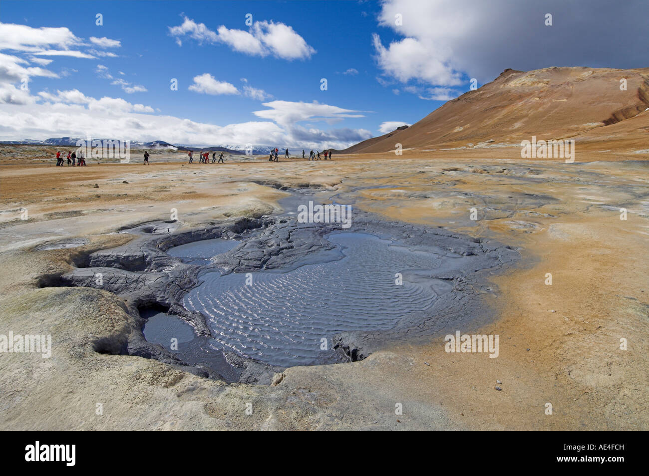 Tourists around the hot mud pools at Namaskard thermal area, Hverarond ...