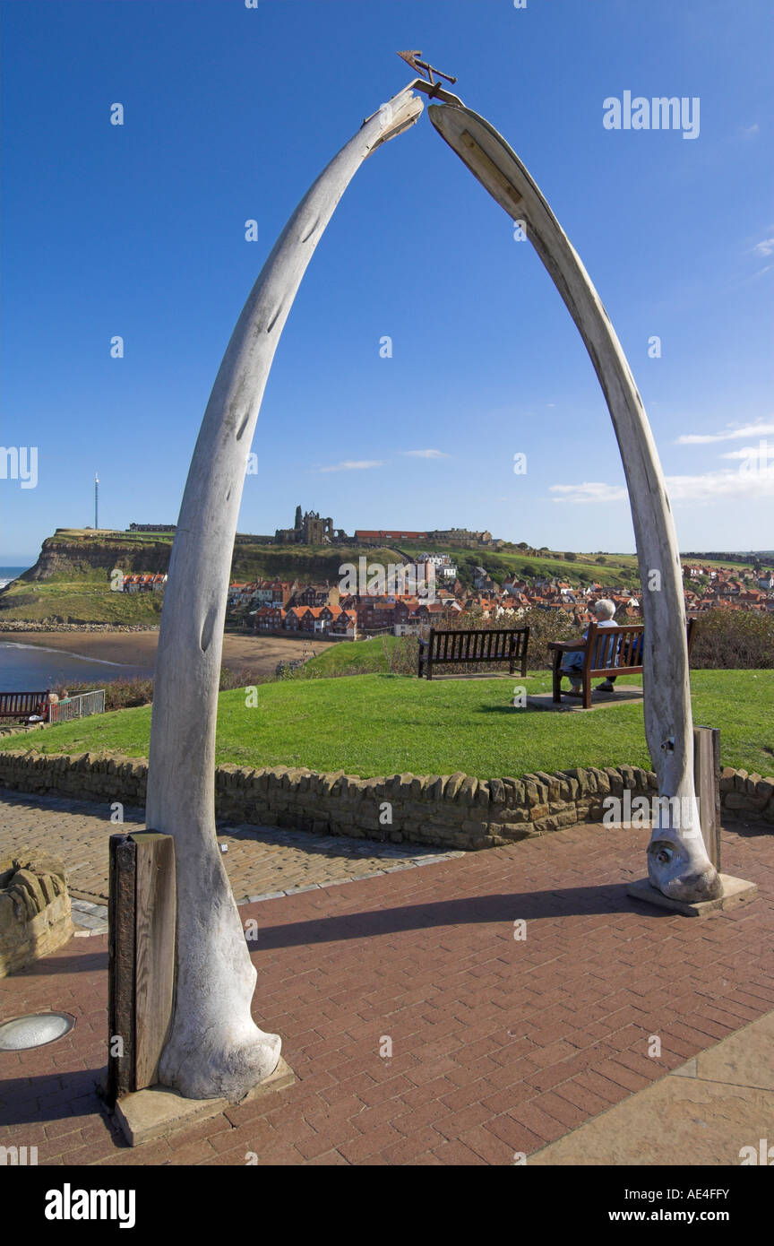 Whalebone arch on Seafront, Whitby abbey ruin in distance, Whitby ...