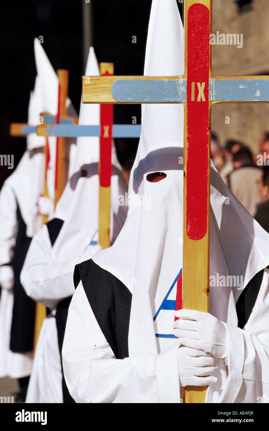 Penitents carrying crosses in procession during Holy Week, Salamanca ...