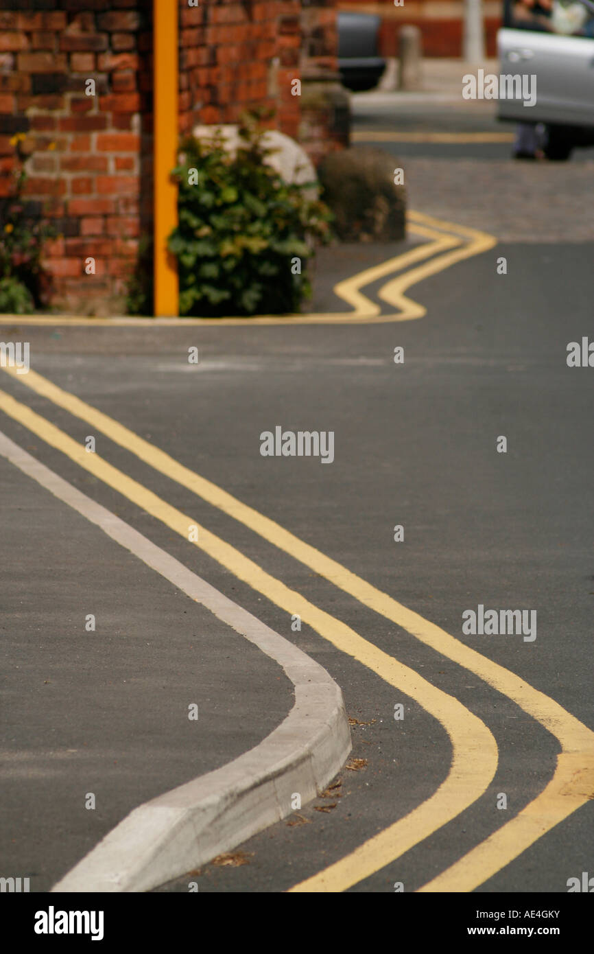 double yellow parking restriction lines painted on tarmac in British ...
