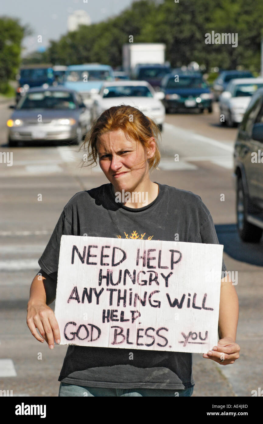 Christian woman with sign begging for help for family in Houston on ...