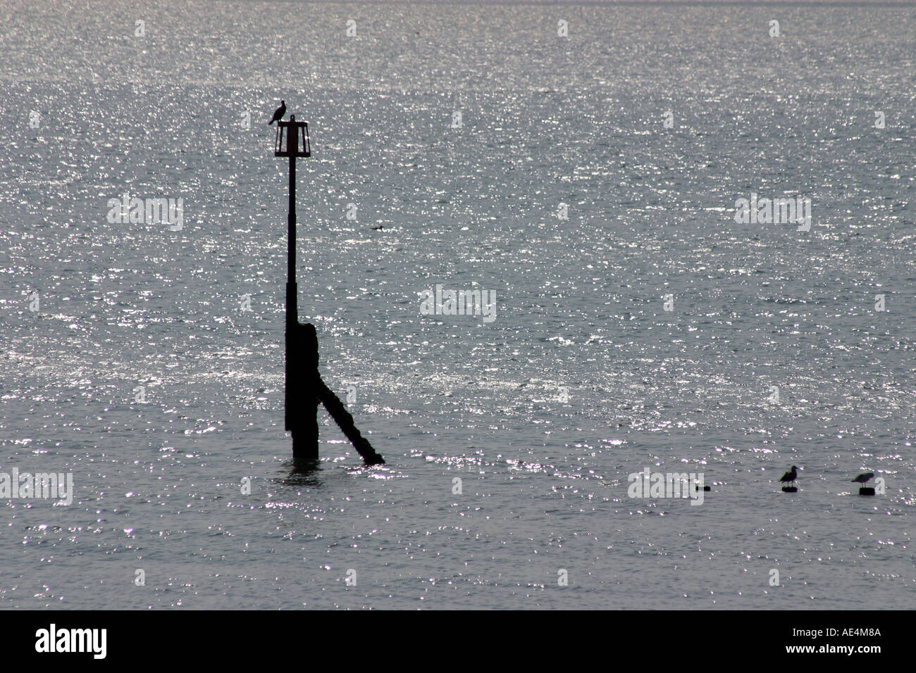 Beacon and warning post on submerged end of a breakwater or groin on ...
