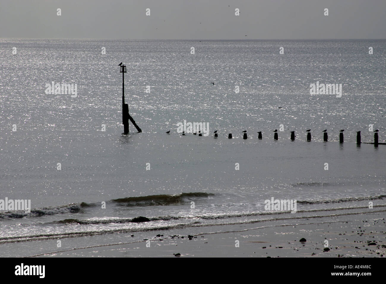 Beacon and warning post on submerged end of a breakwater or groin on ...