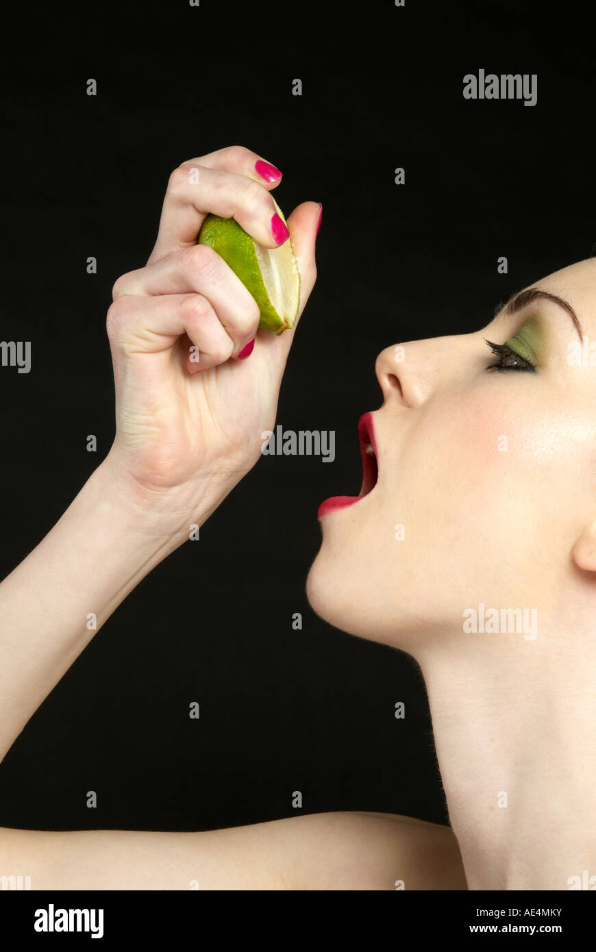 Squeezing lime mouth hi-res stock photography and images - Alamy