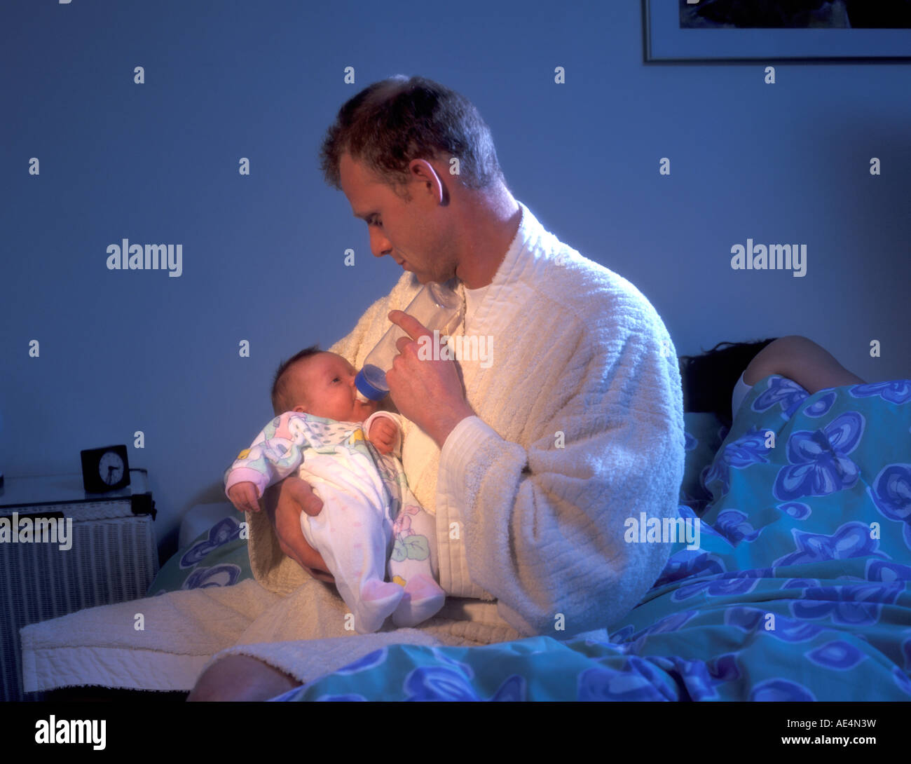 Father feeding child at night hi-res stock photography and images - Alamy