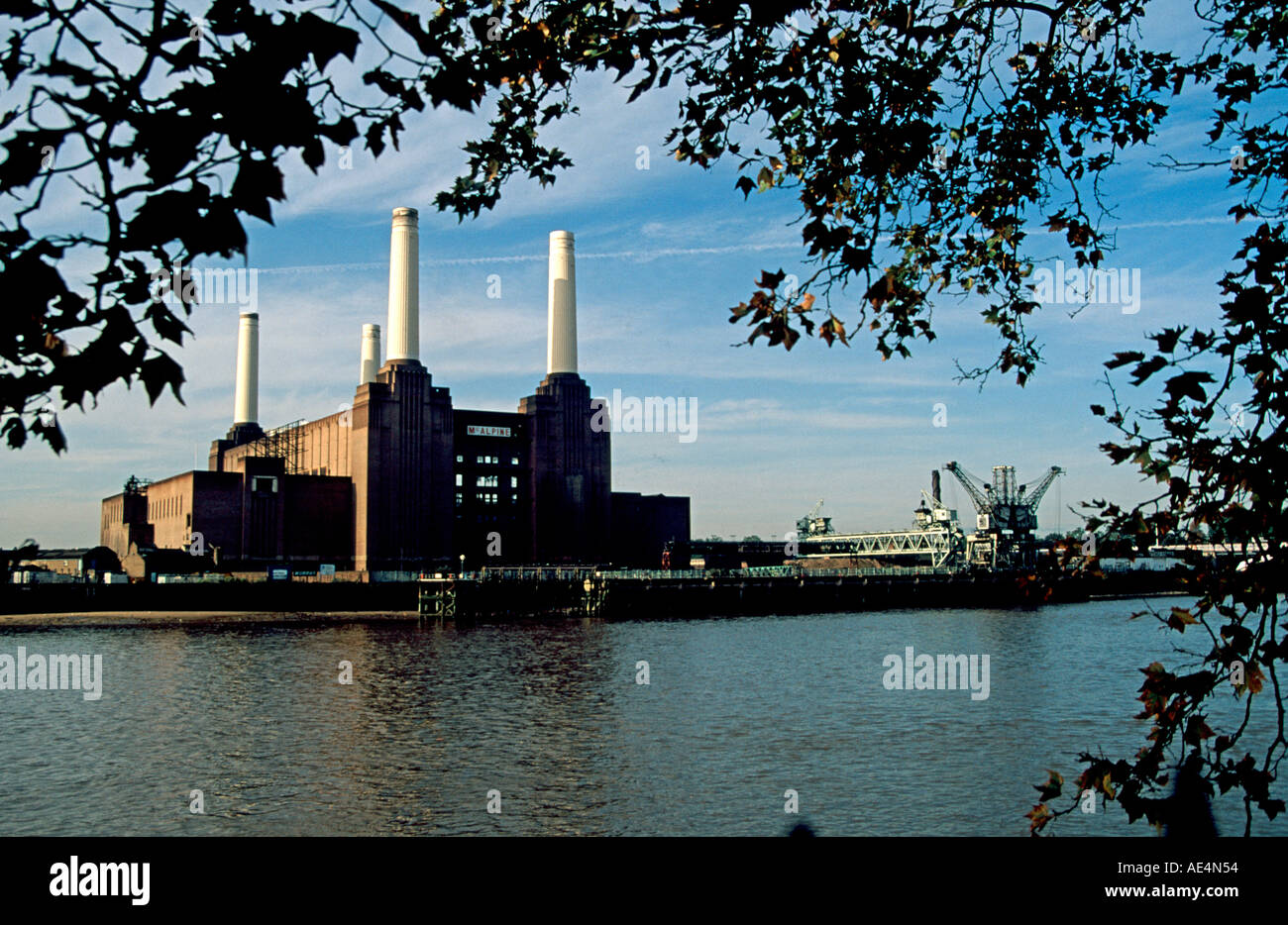 Battersea Power Station with River Thames through trees London SW8 ...