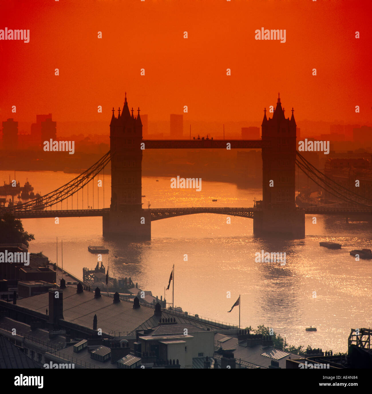 Tower Bridge in silhouette from the west with dark red sky and River ...