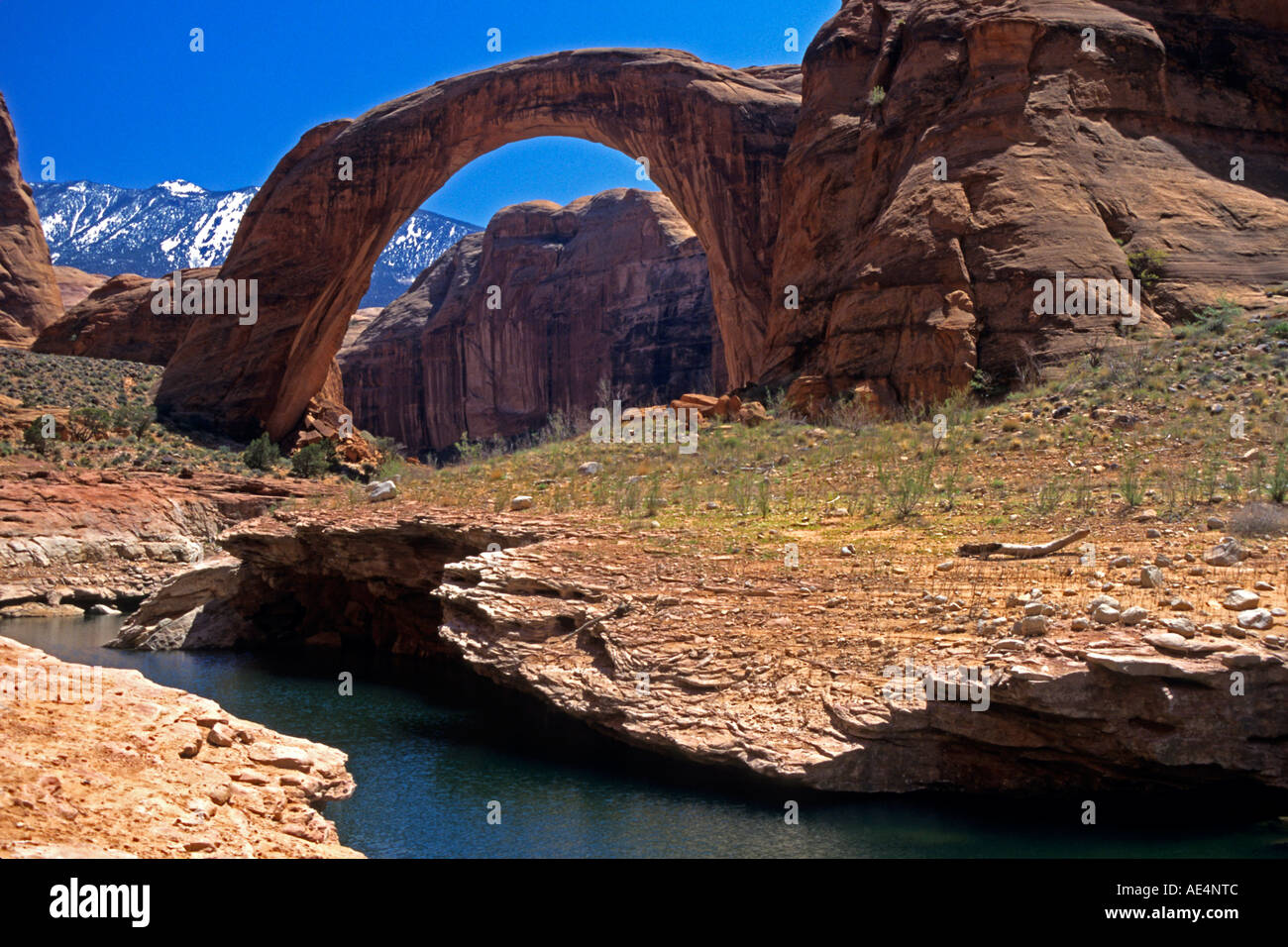 Rainbow Bridge spans landscape at Lake Powell, Arizona Stock Photo - Alamy