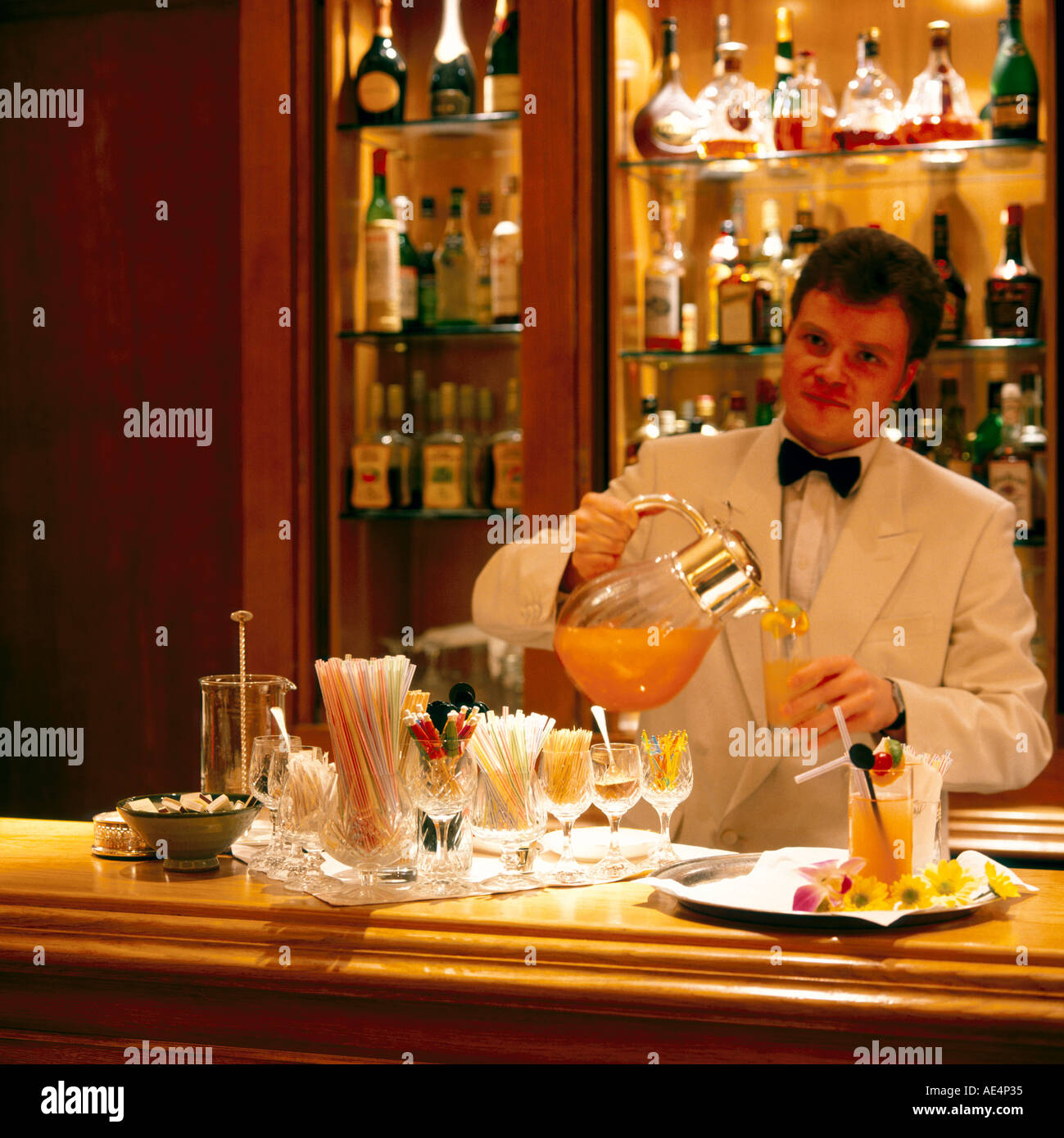 Barman serving drinks in a hotel Stock Photo - Alamy