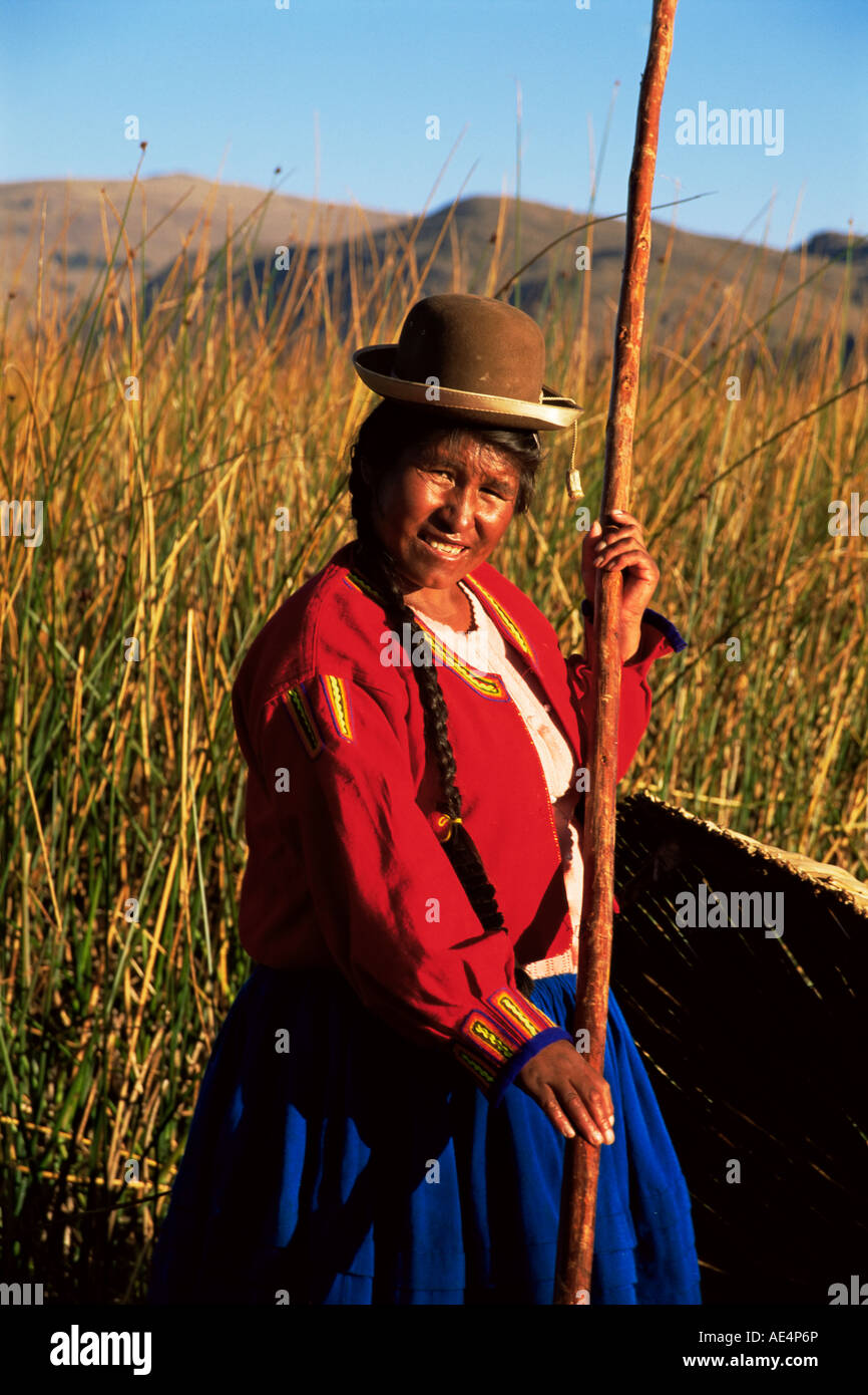 Uros Indian woman in traditional reed boat, Islas Flotantes, Lake ...