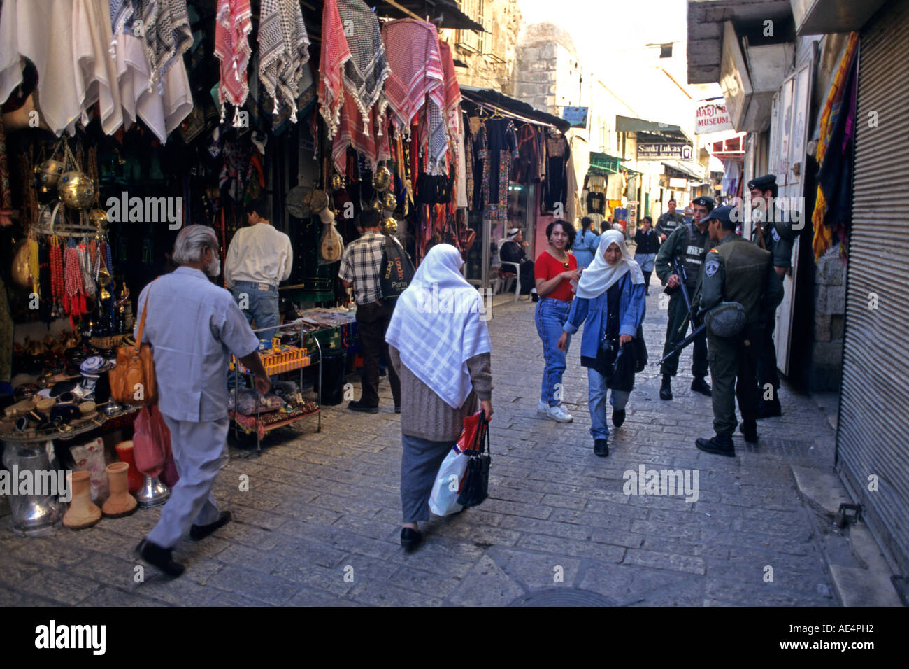 Residents walk past street hi-res stock photography and images - Alamy