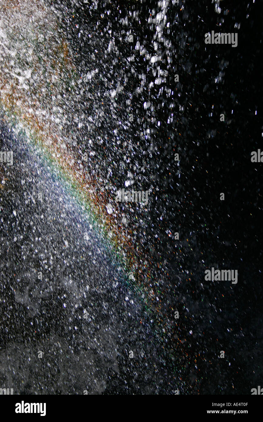 Rainbow in waterfall Stock Photo - Alamy