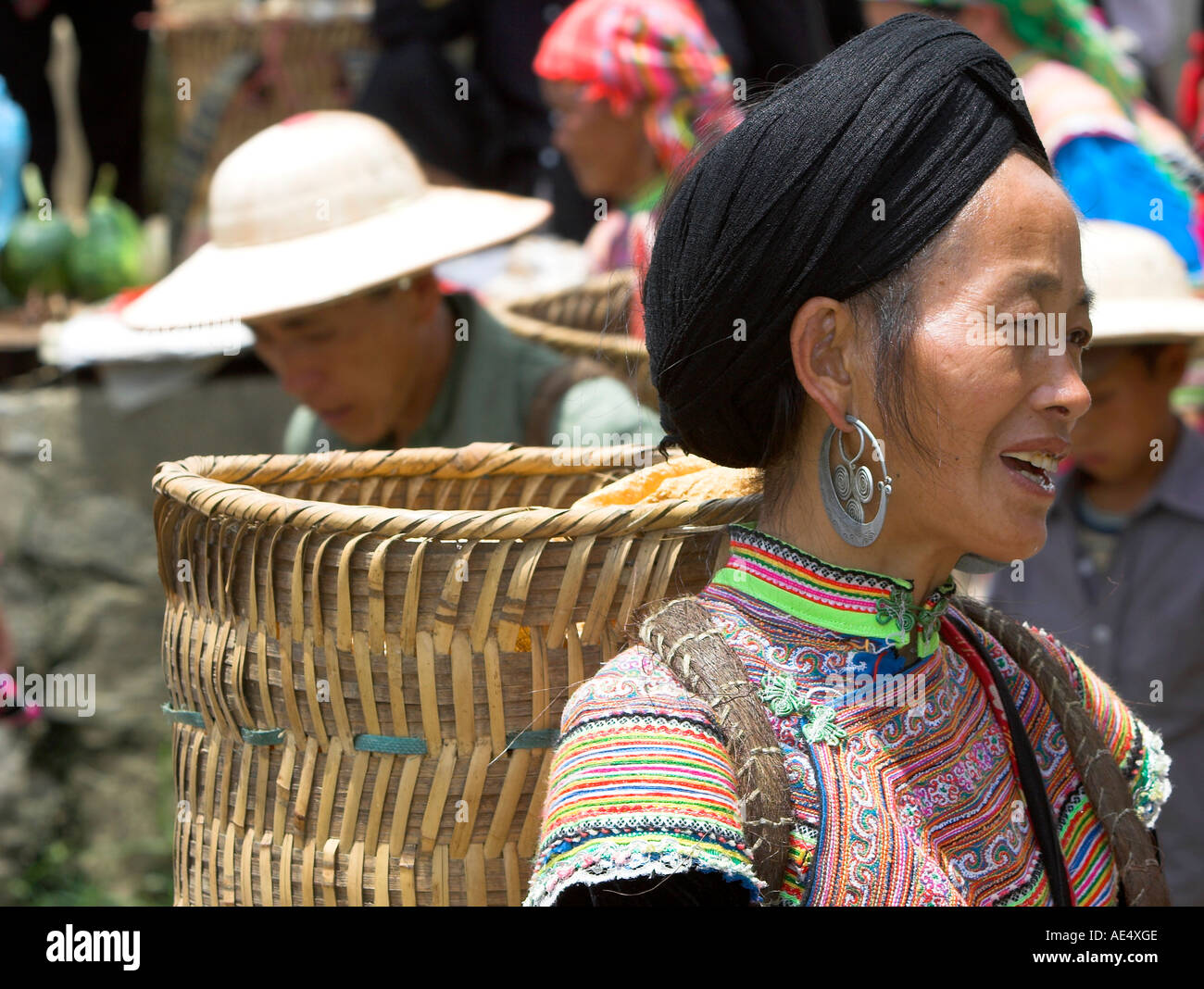 Woman with shoulder basket Bac Ha hilltribe market known for colourful ...