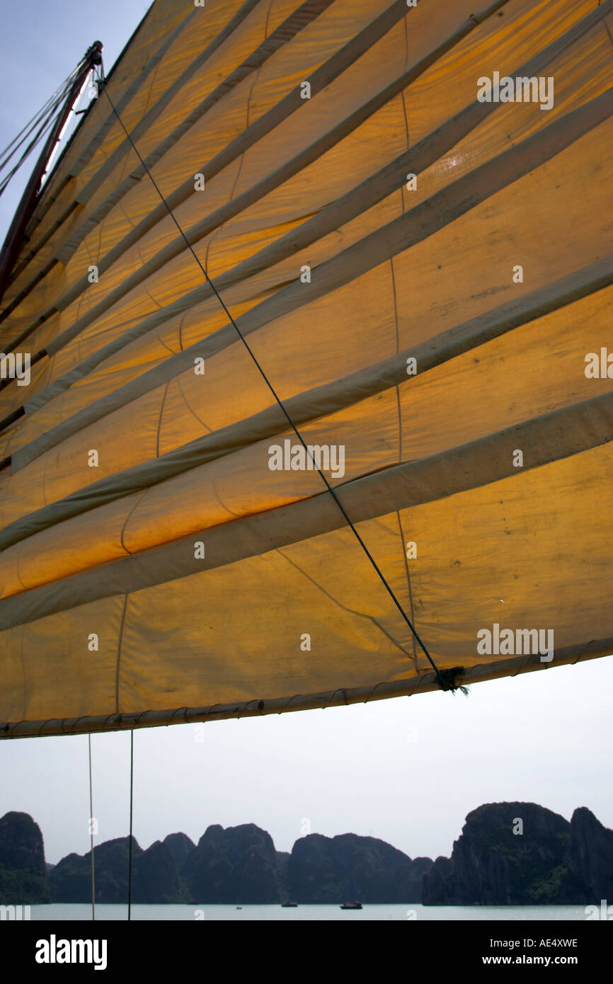 Cruising junk sail and rocky islands of Halong Bay Vietnam Stock Photo ...