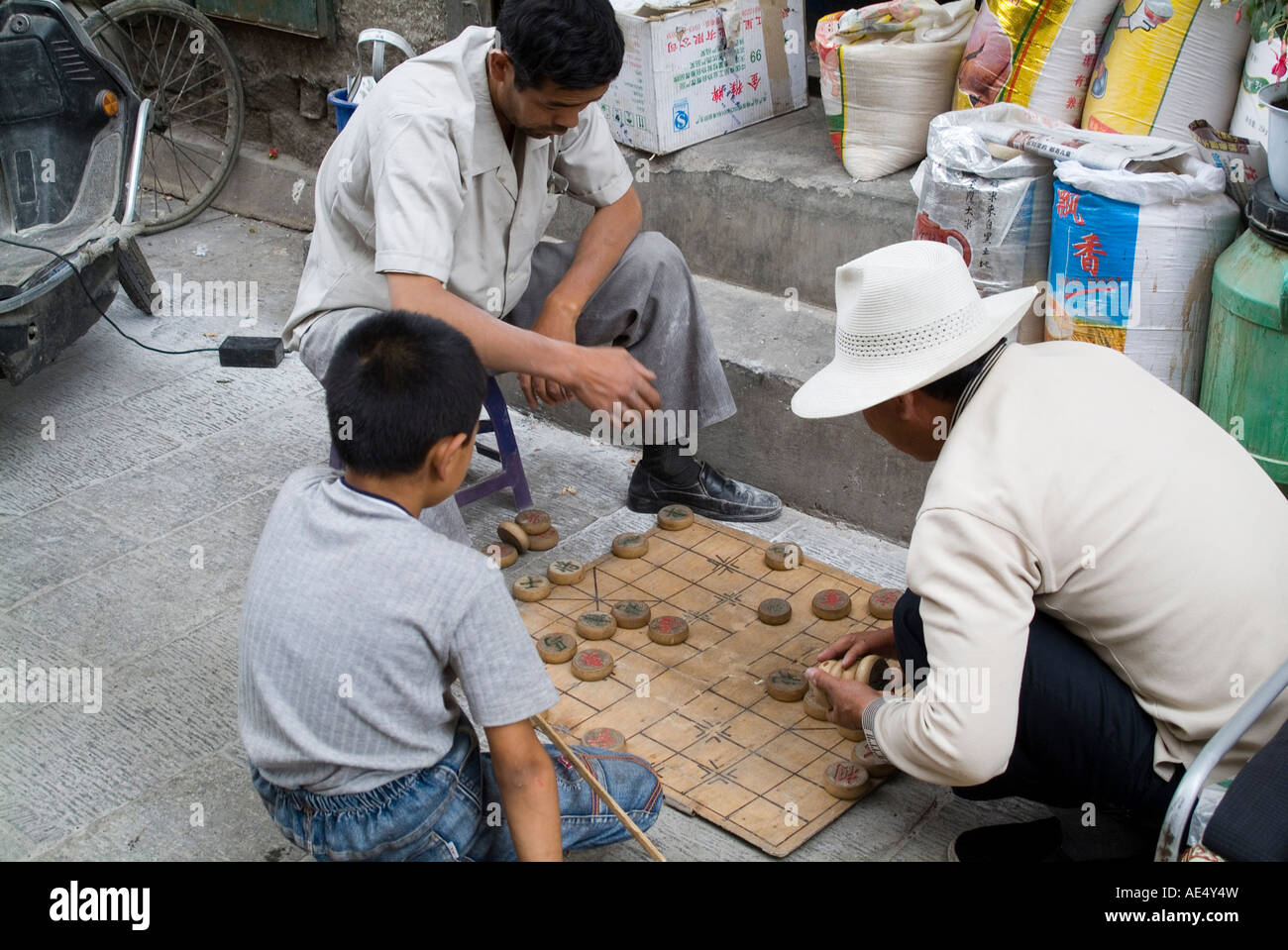 Playing a board game, Barkhor, Lhasa, Tibet, China, Asia Stock Photo ...
