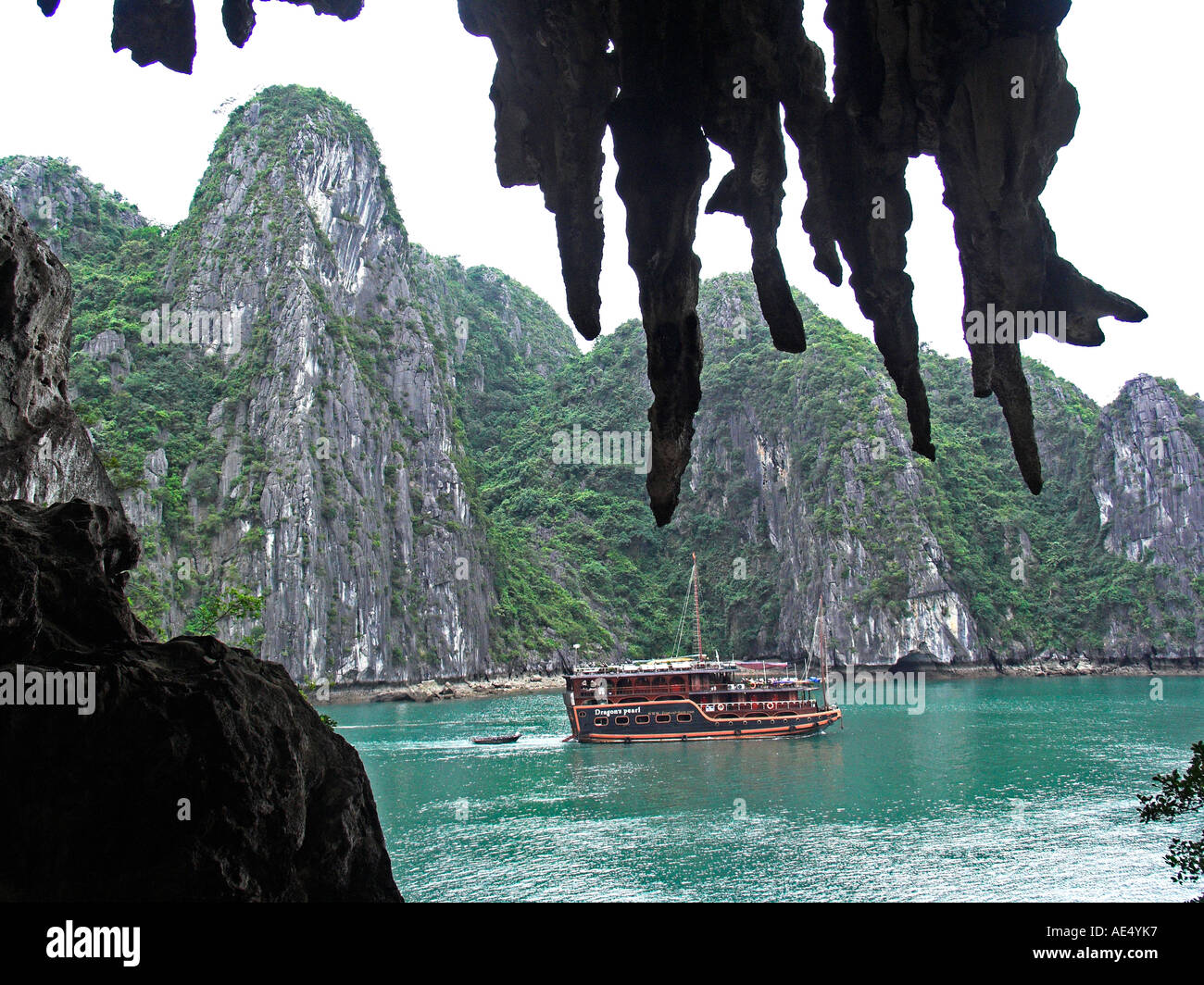 Rocks and stalactites in Hang Trong the Drum Grotto frame the Dragons ...