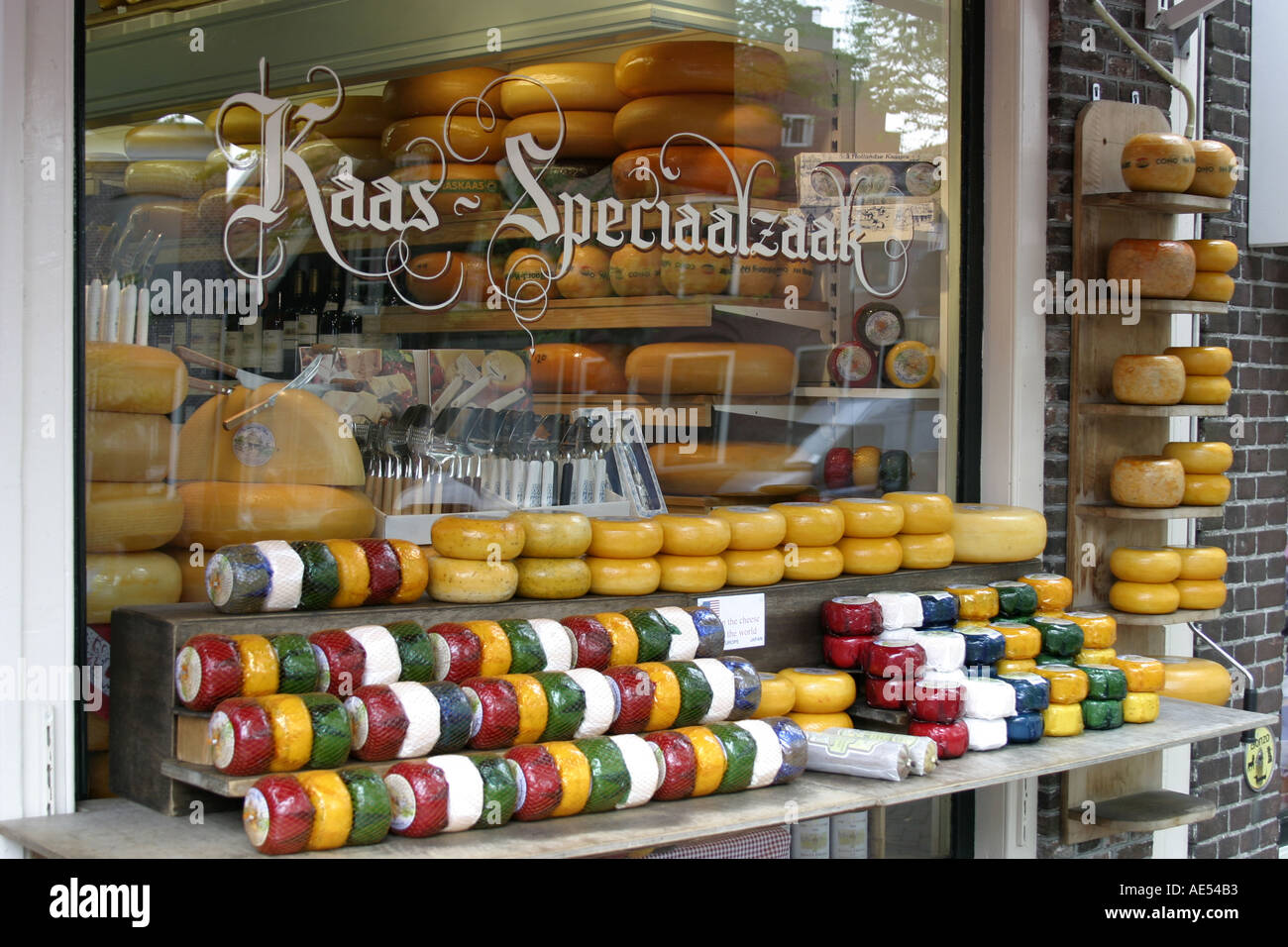 Cheese shop window with reflections on the shopfront window Stock Photo ...