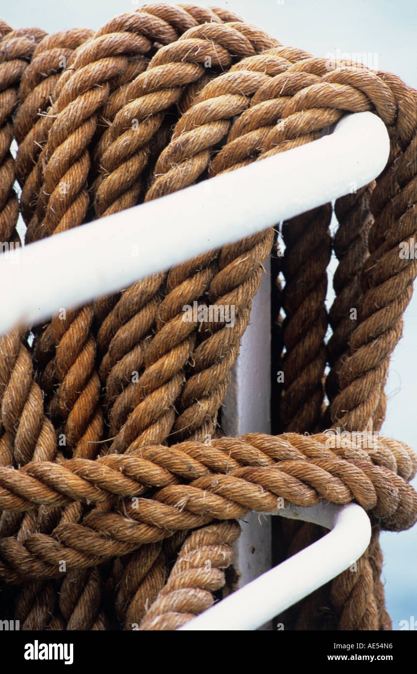 coiled natural fibre cordage hemp/manilla/sisal on guardrails of ship ...