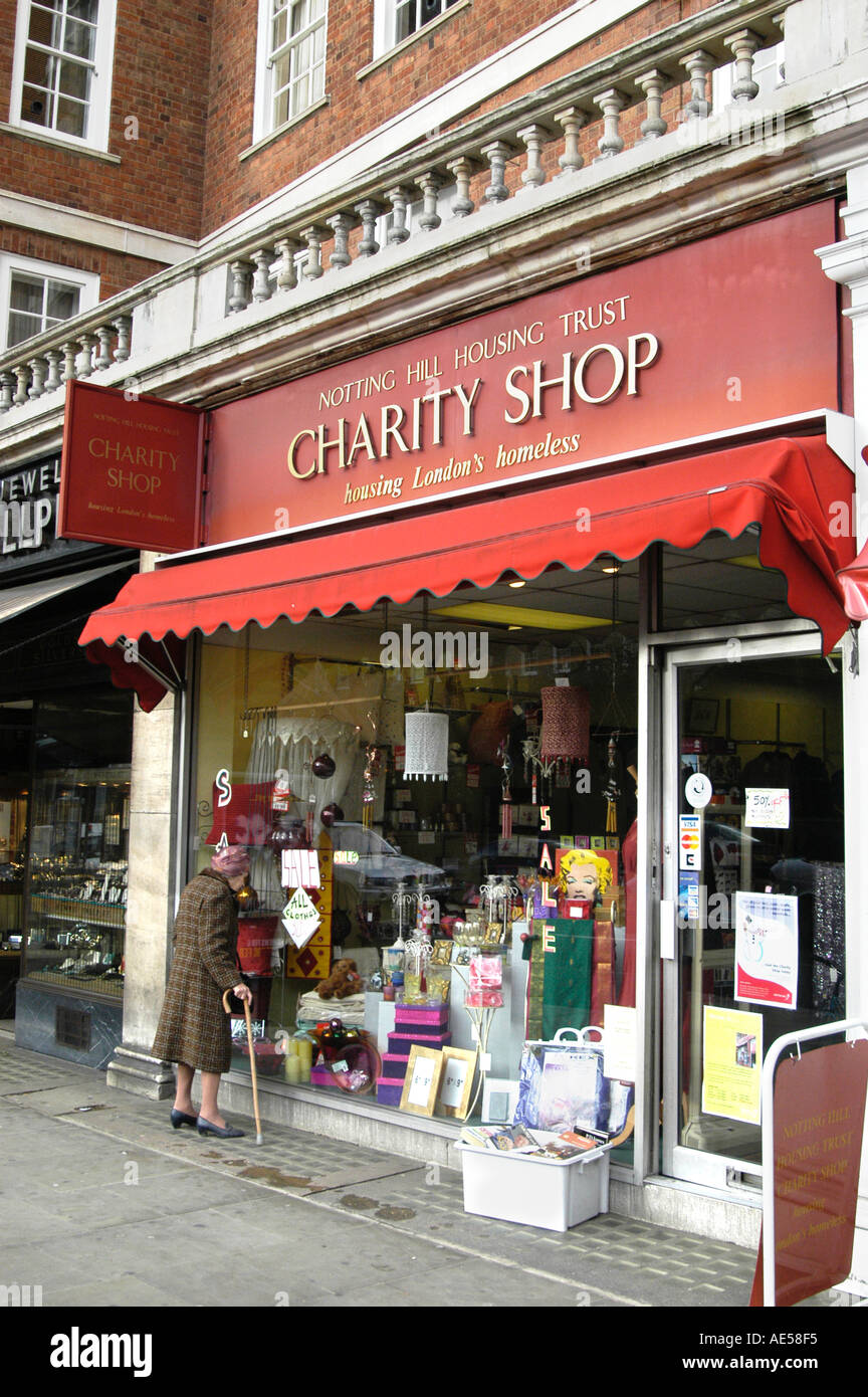 Elderly lady at a charity shop, London, England, UK Stock Photo - Alamy
