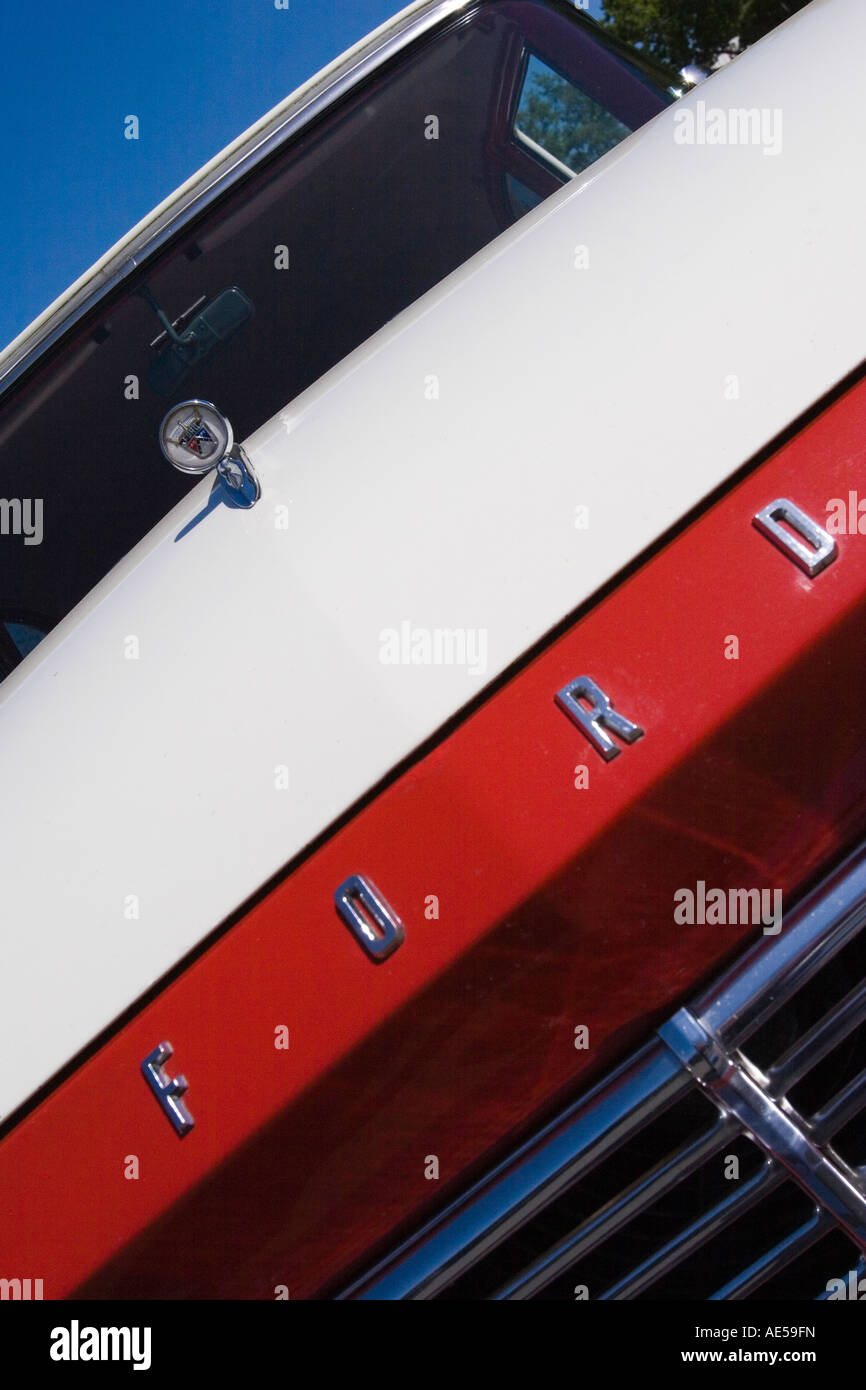 Front hood of a red and white 1957 Ford Custom 300 with Ford name plate ...