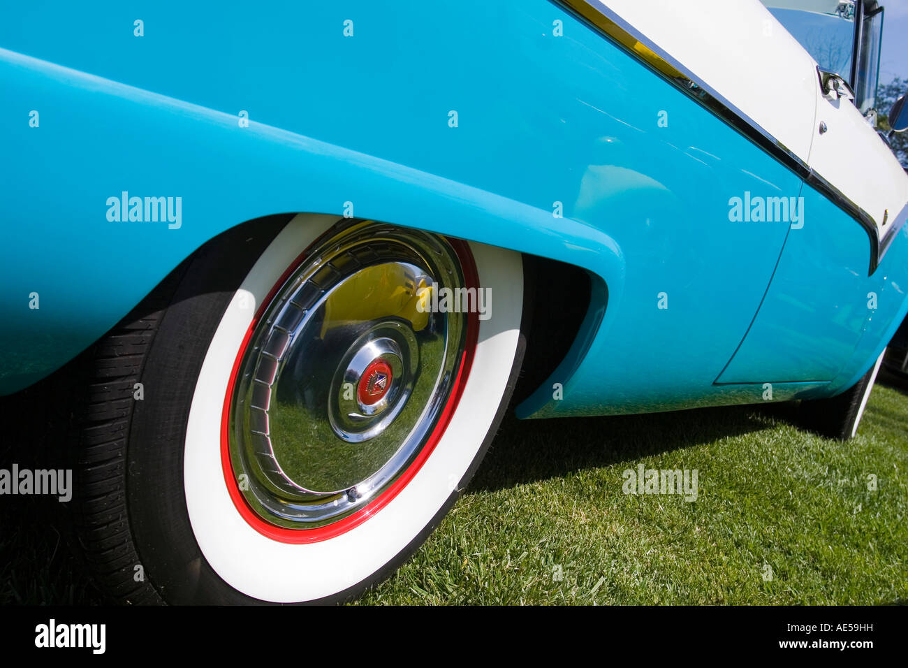 Side of a turquoise and white 1955 Ford Fairlane convertible classic ...