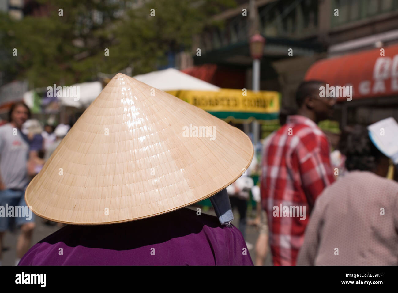 Woman wearing straw peasant hat at the International District Chinatown ...