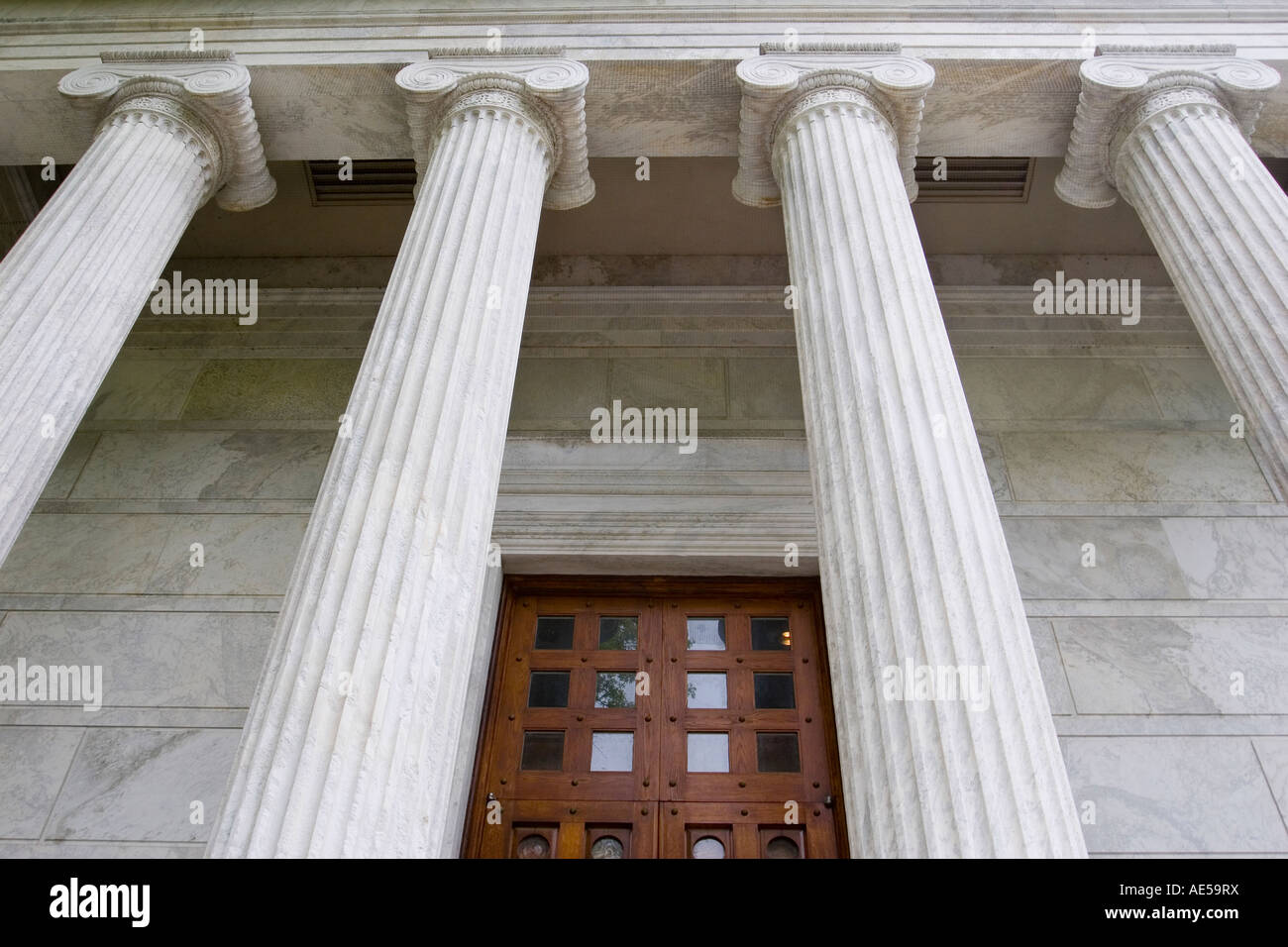 Massive fluted white marble pillars in the ionic style in front of Whig ...
